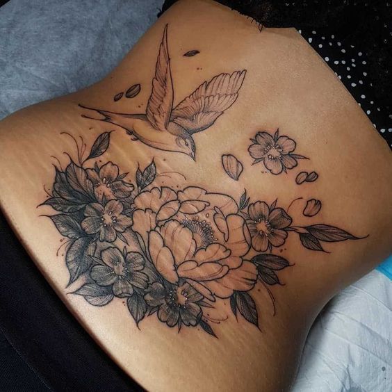 15 Lower Back Tattoos You NEED to See! [2025]
